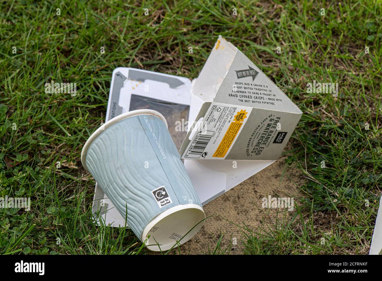 Discarded sandwich wrapper and coffee cup Stock Photo - Alamy