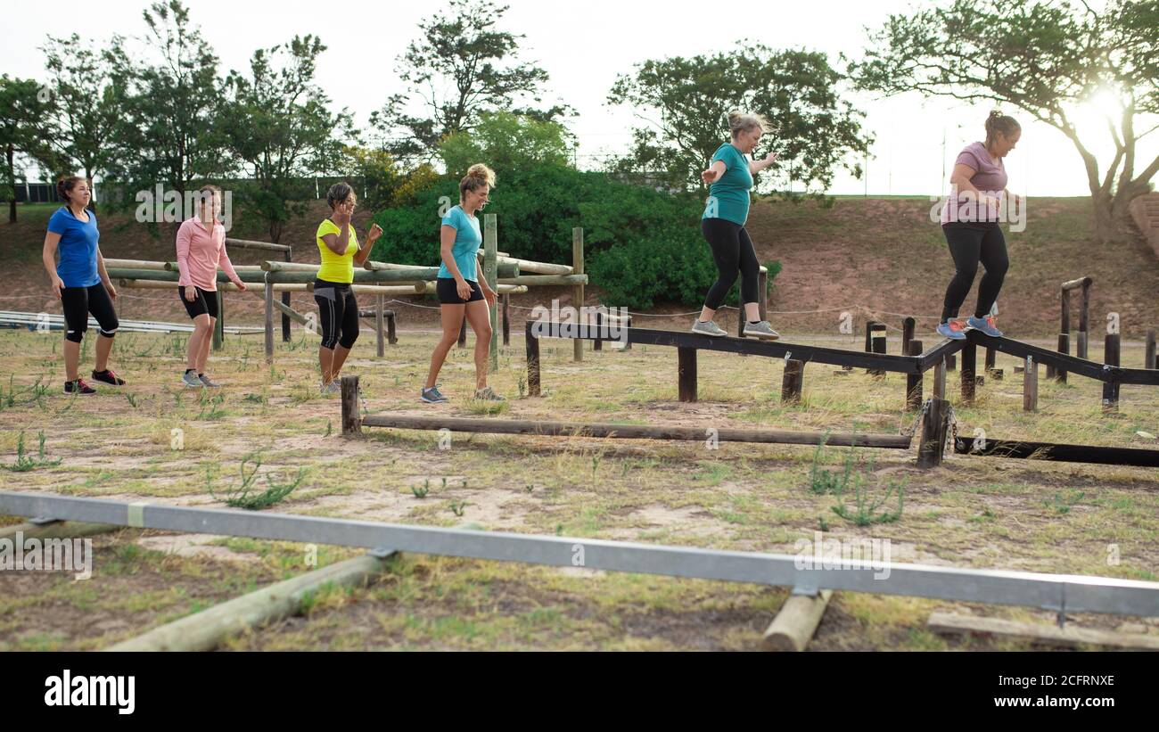 Group of woman walking through obstacle course at boot camp Stock Photo ...
