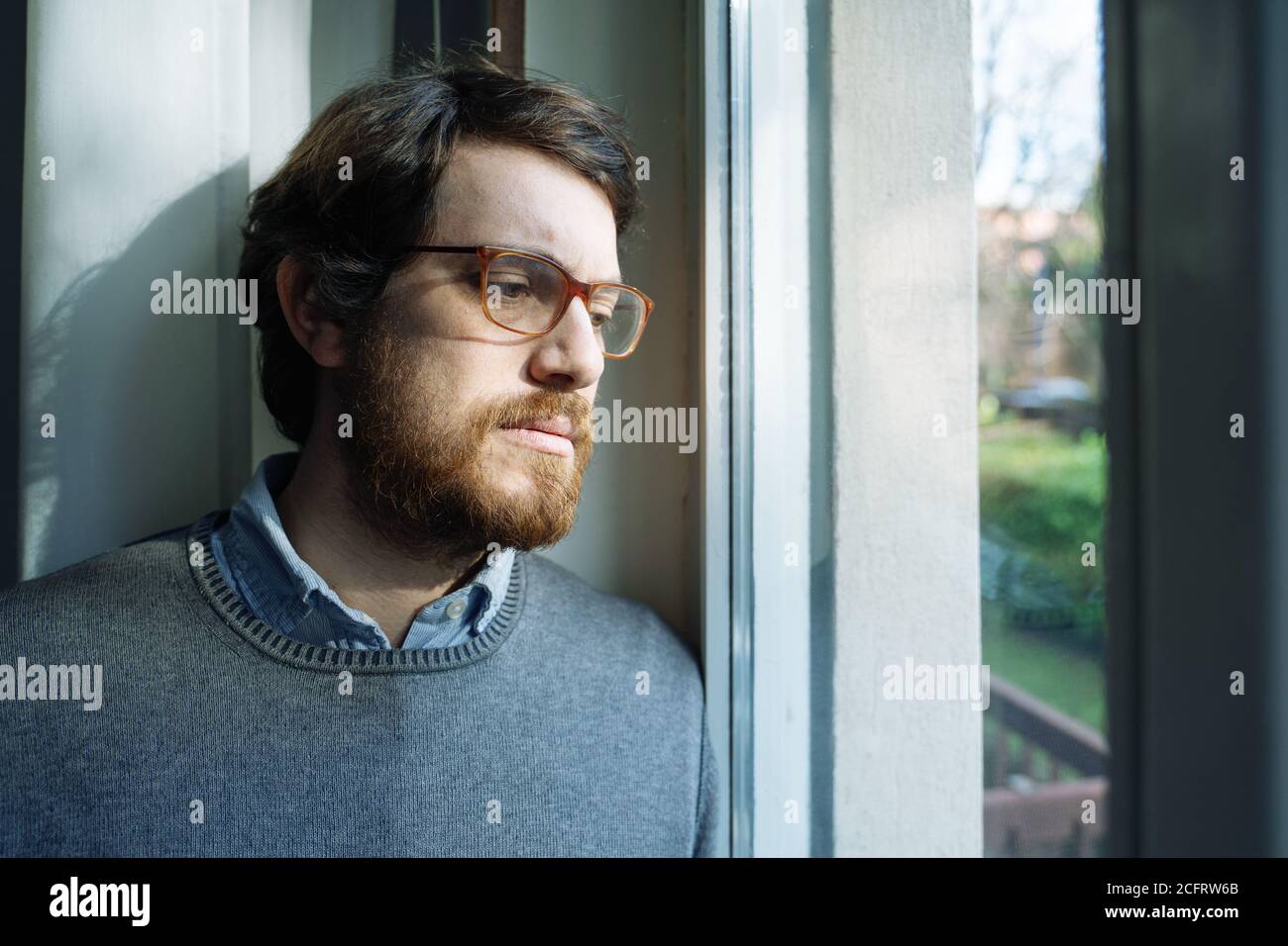 Man longing looking window hi-res stock photography and images - Alamy