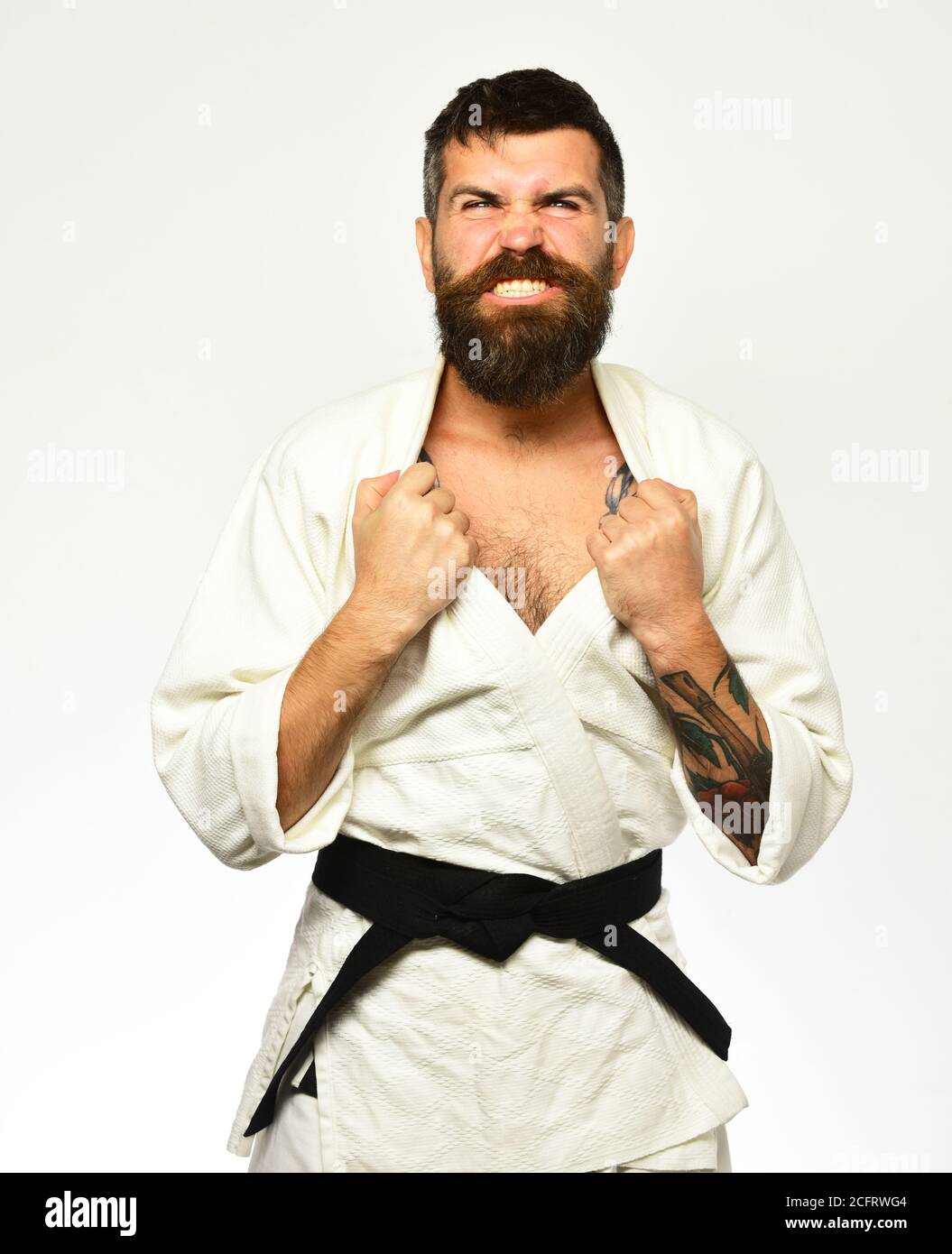 Karate man with angry face in uniform. Jiu Jitsu master with black belt ...