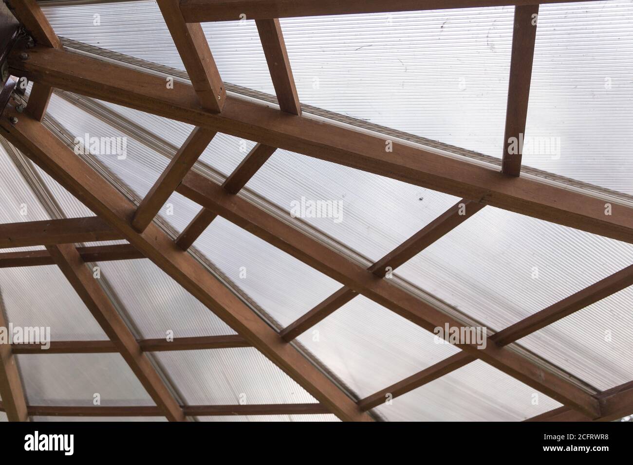closeup to a ceiling with joining wooden beams and transparent ...
