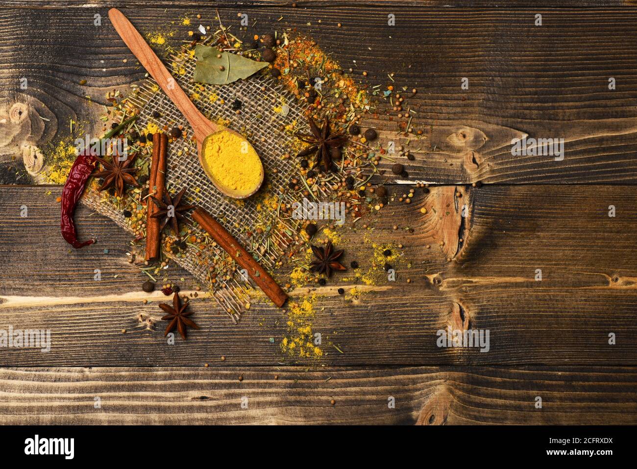 Cuisine and flavouring concept. Composition of condiment on sackcloth ...