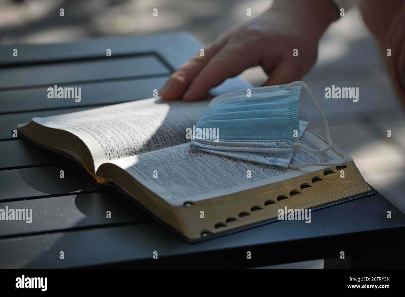 Protective A Medical Respiratory Mask On Holy Bible at Sunset Stock ...