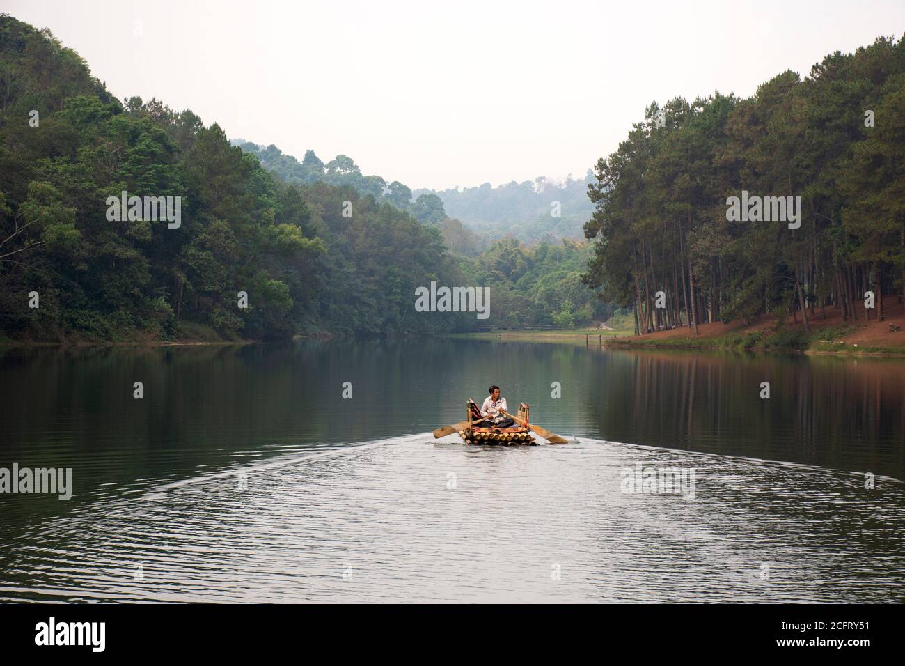 Thai people and travelers foreign travel visit rowing bamboo rafts in ...