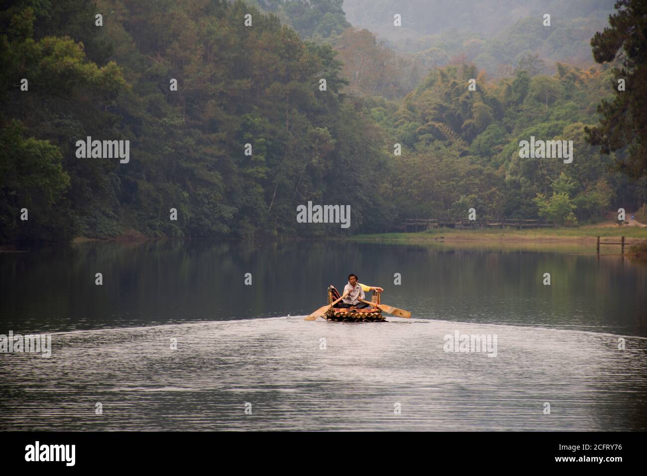Thai people and travelers foreign travel visit rowing bamboo rafts in ...