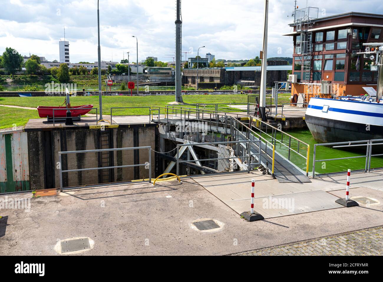 Canal lock with a barge waiting for the gate to open on the Moselle ...