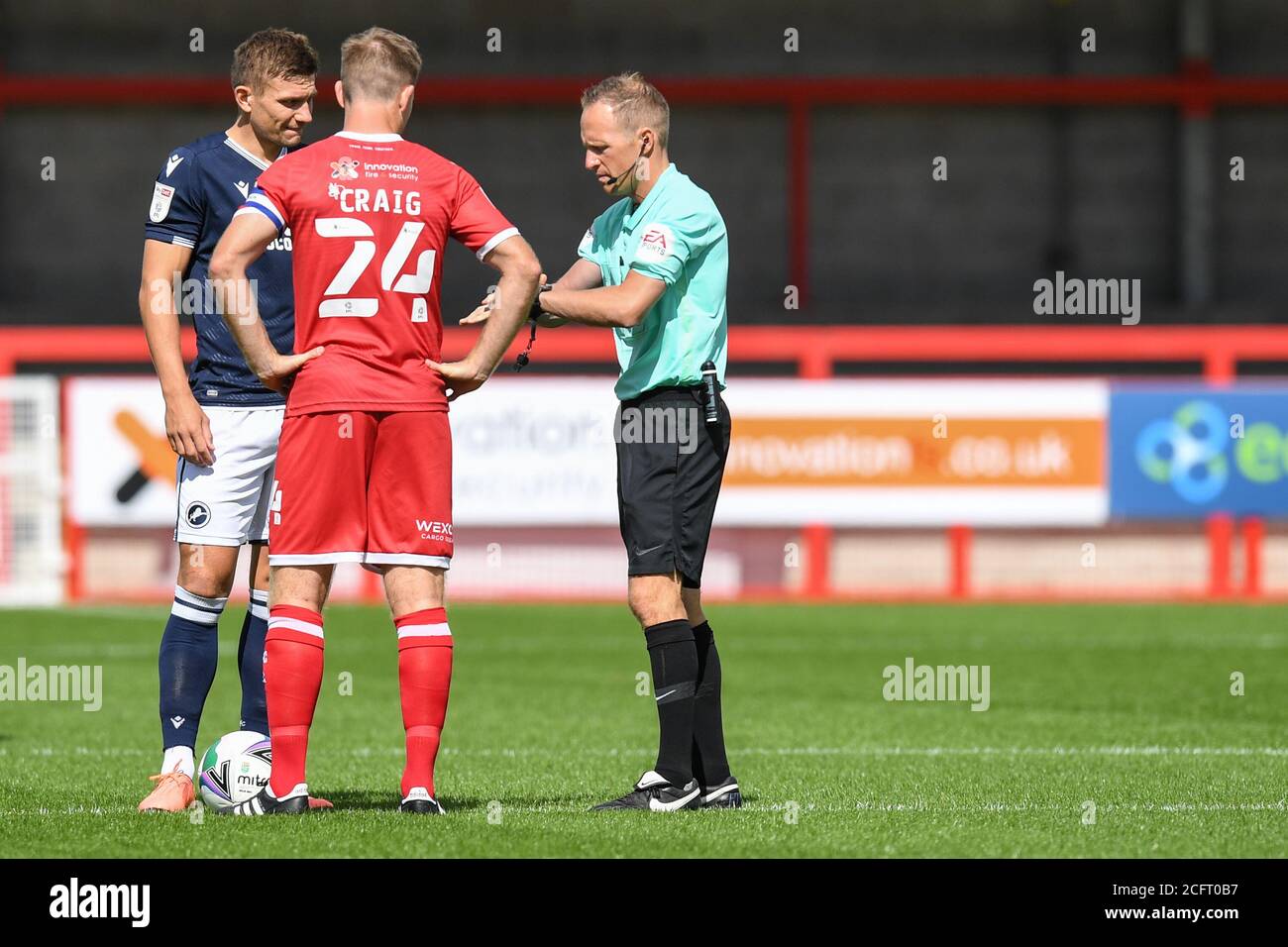Millwall and Crawley captains take the toss with referee David Rock ...