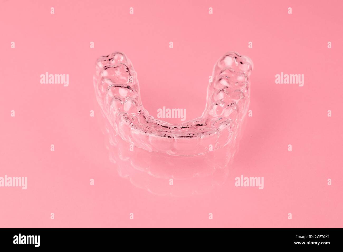 Invisible aligner or retainer for the lower teeth on the pink ...