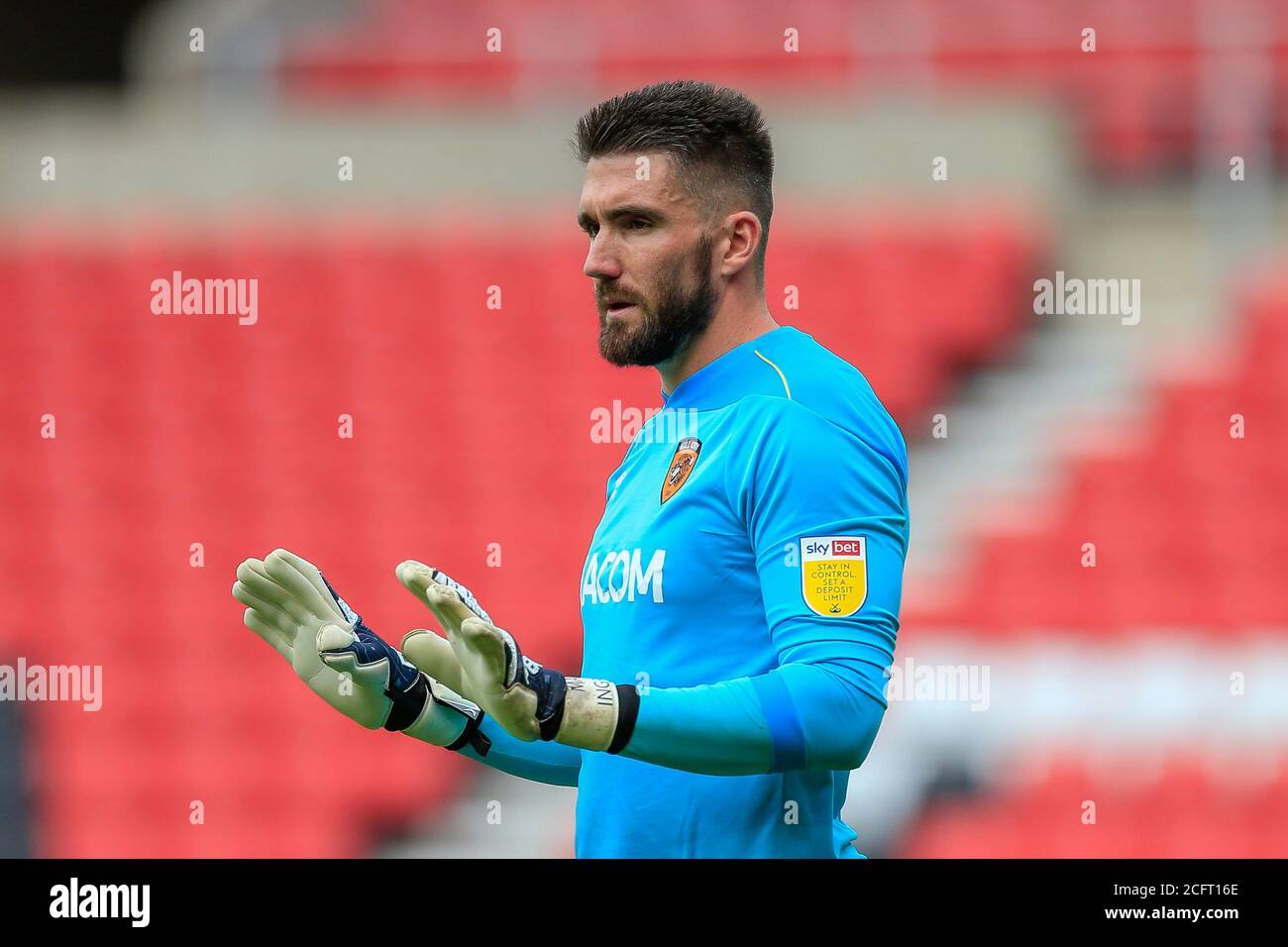 Matt Ingram (13) of Hull City calms down his players Stock Photo - Alamy