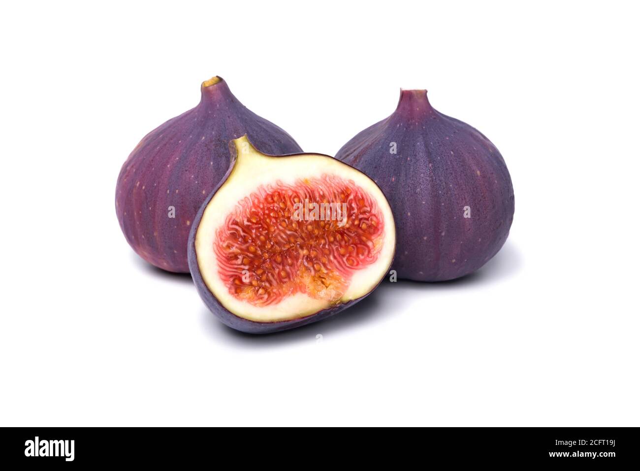 Two fresh figs and half isolated on white background Stock Photo - Alamy