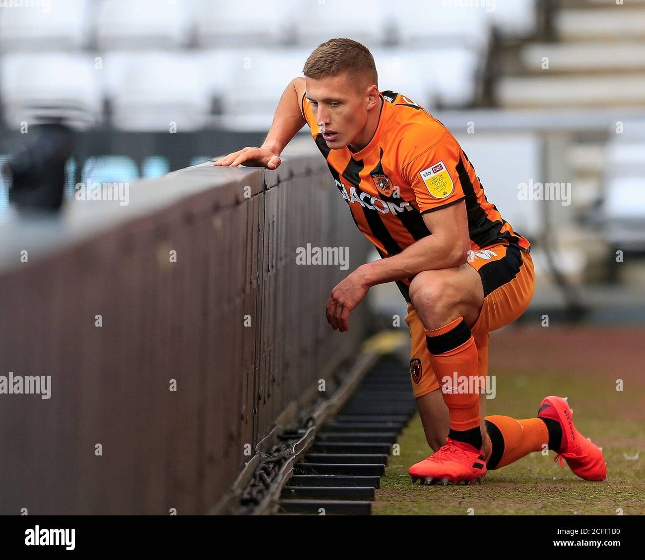 Greg Docherty (33) of Hull City takes a moment after he ends up on the ...
