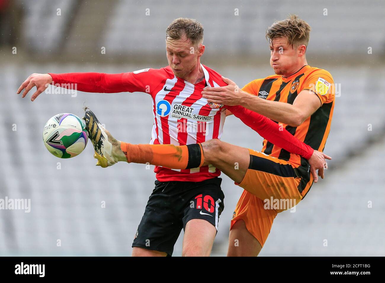 Reece Burke (5) of Hull City challenges Aiden O'Brien (10) of ...