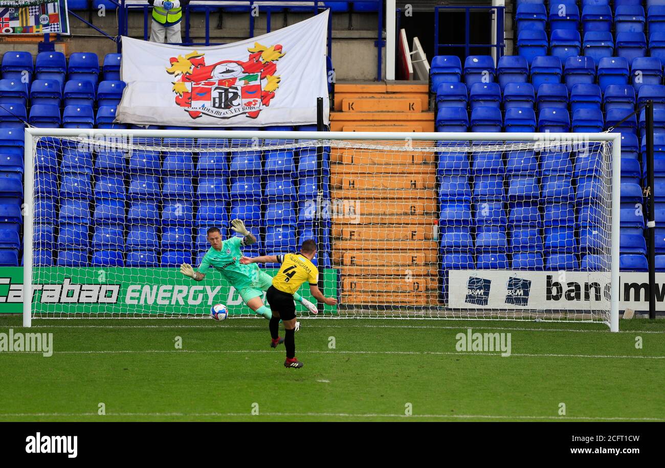 Josh Falkingham (4) of Harrogate Town scores the winning penalty in the ...