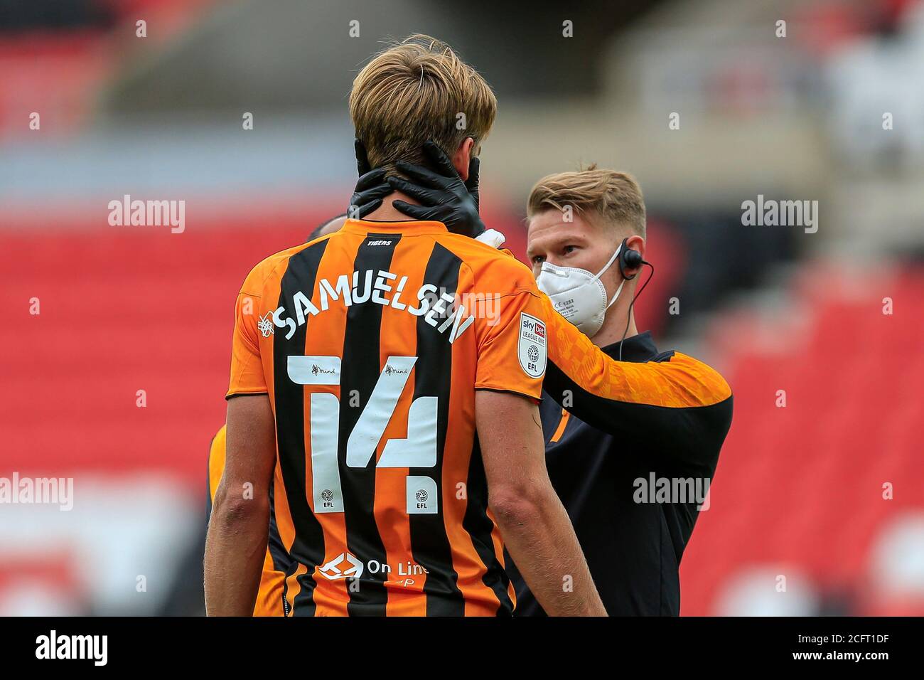 Martin Samuelsen (14) of Hull City undergoes a concussion test after a ...