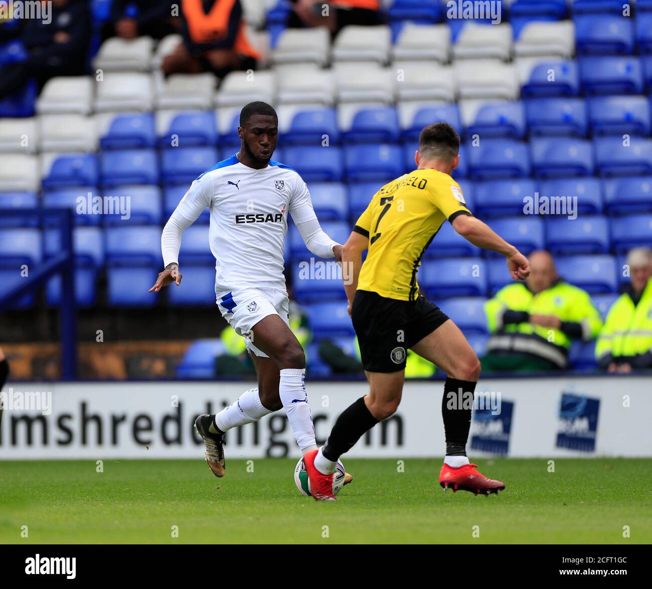 Corey Blackett-Taylor (11) of Tranmere Rovers runs at Ryan Fallowfield ...