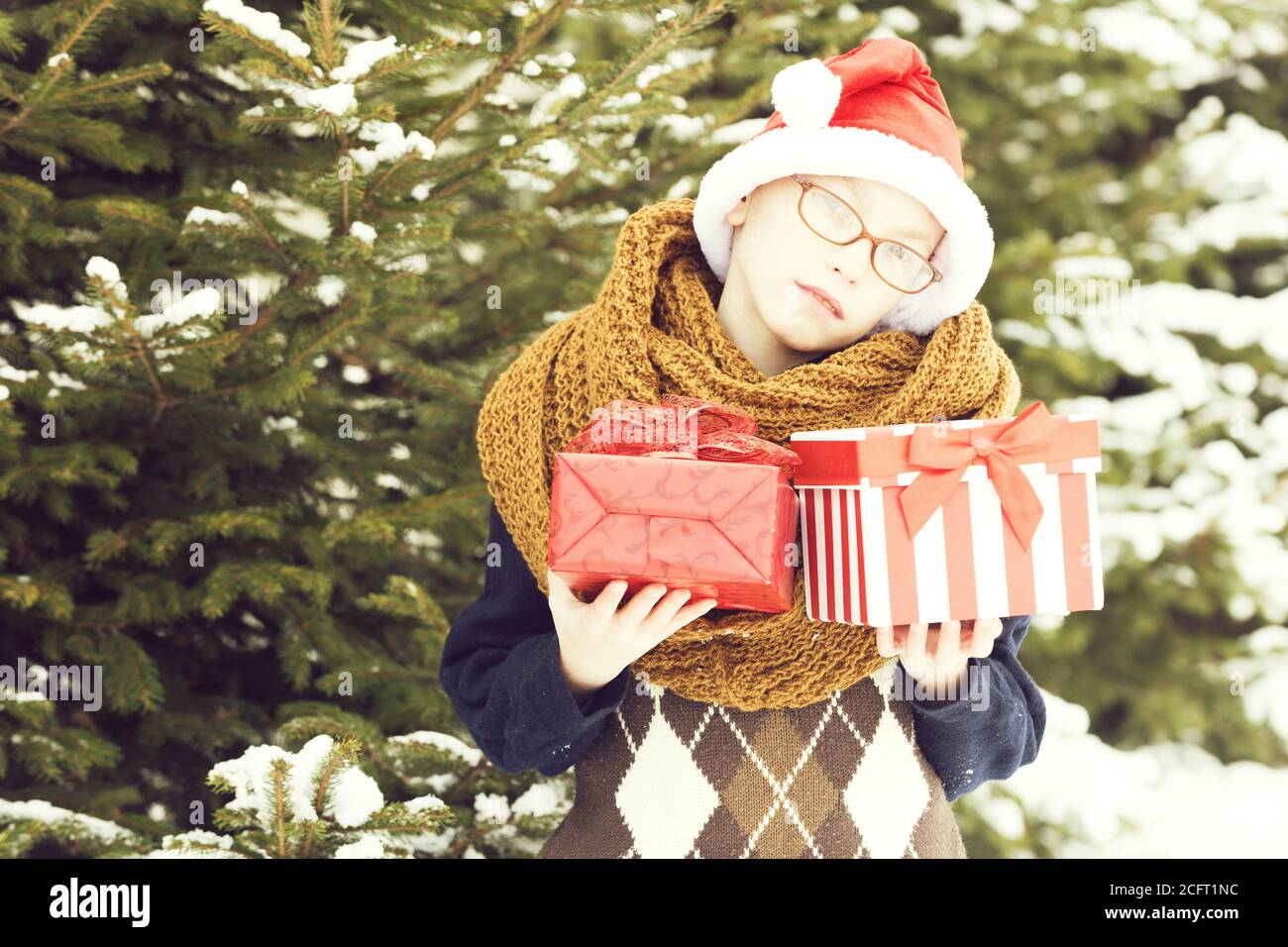 small boy or cute nerd kid in glasses, hat, sweater and fashionable ...