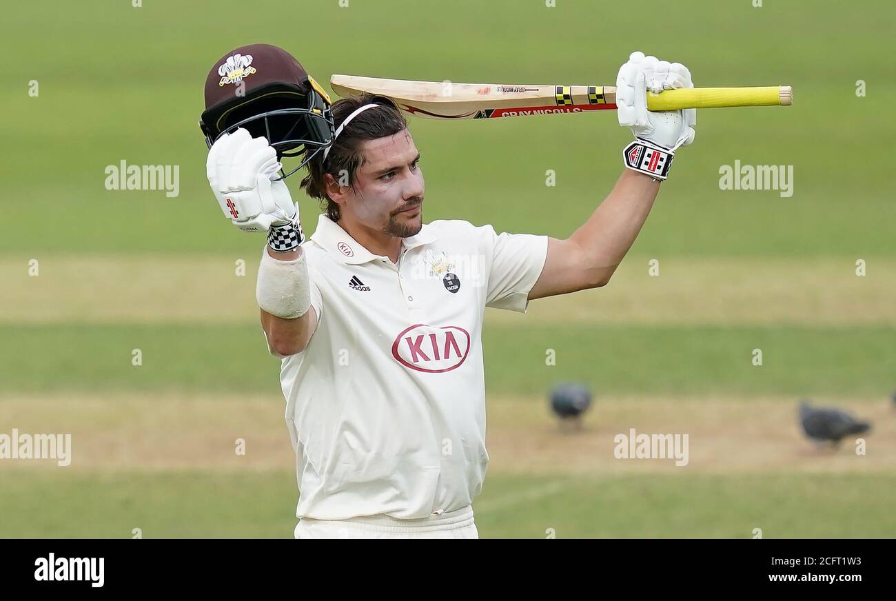 Surrey's Rory Burns celebrates reaching his century during day two of ...