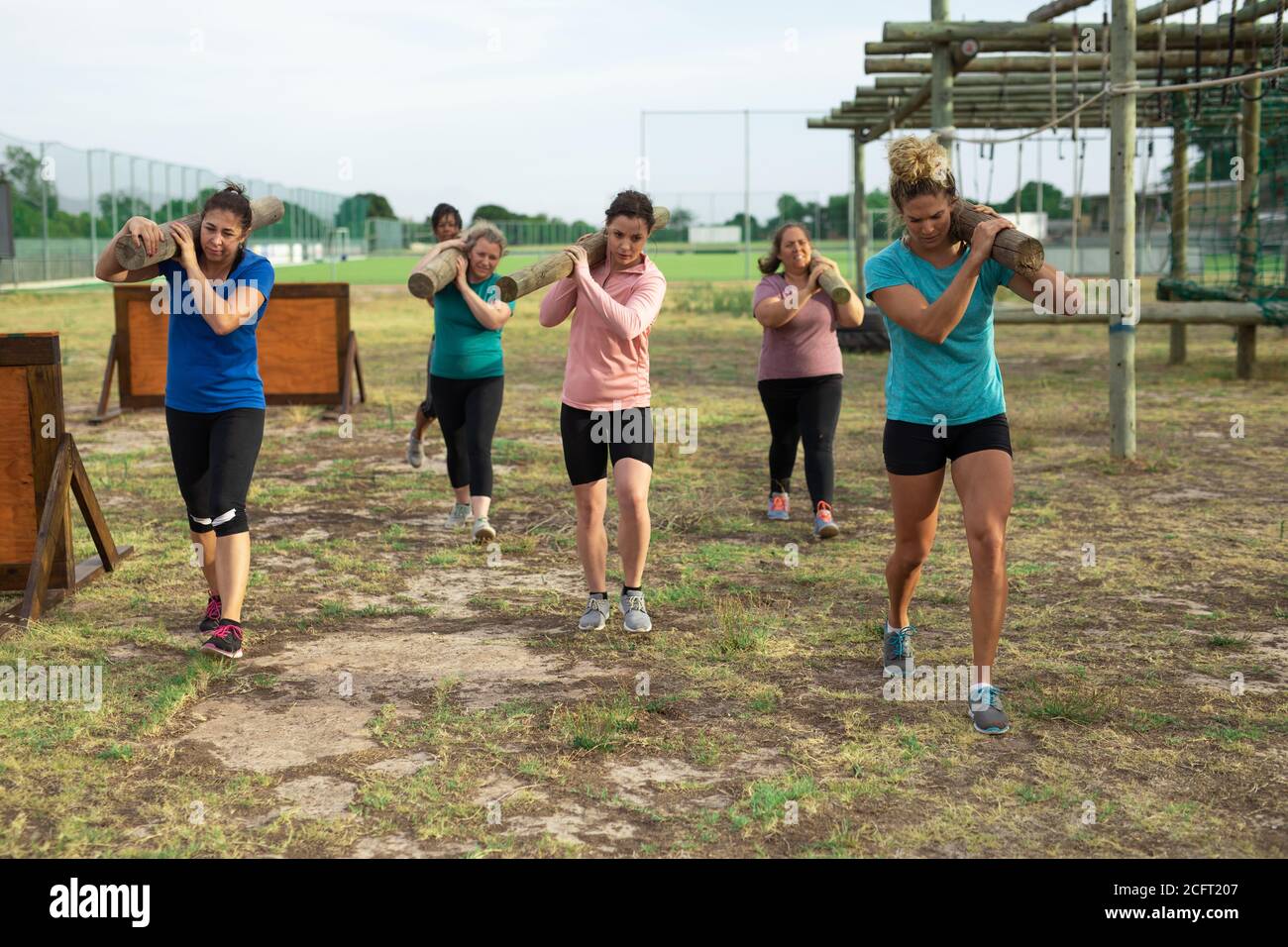 Woman log carrying hi-res stock photography and images - Alamy