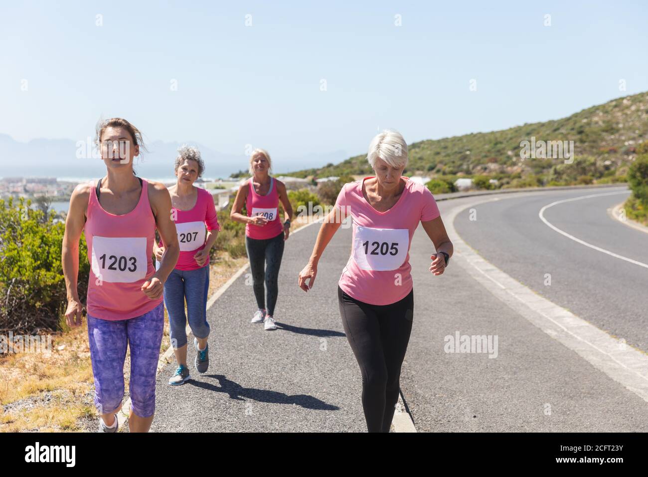 Group of woman running Stock Photo - Alamy