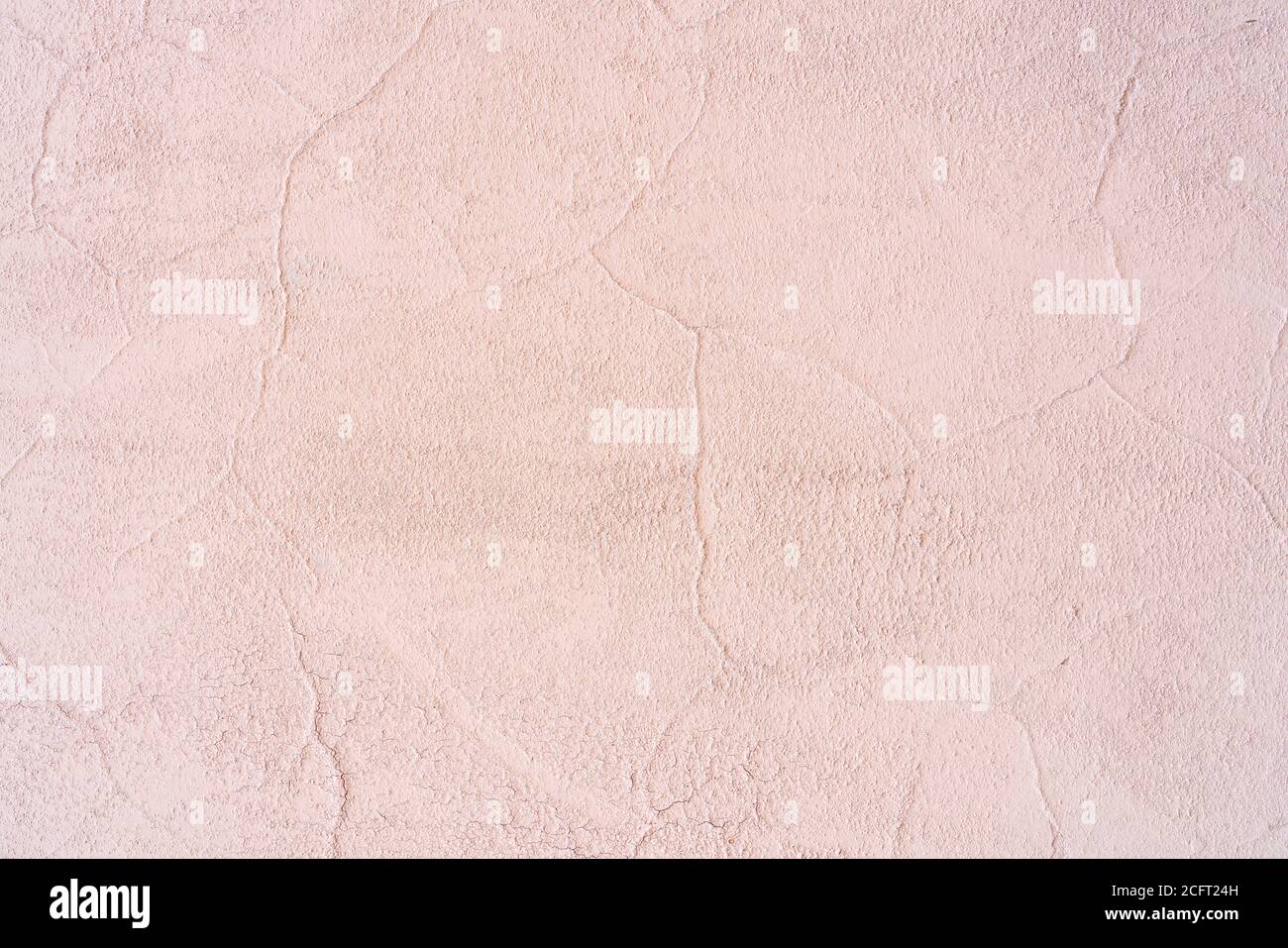 Peach wall of the building. Rough plaster surface. Abstract background ...