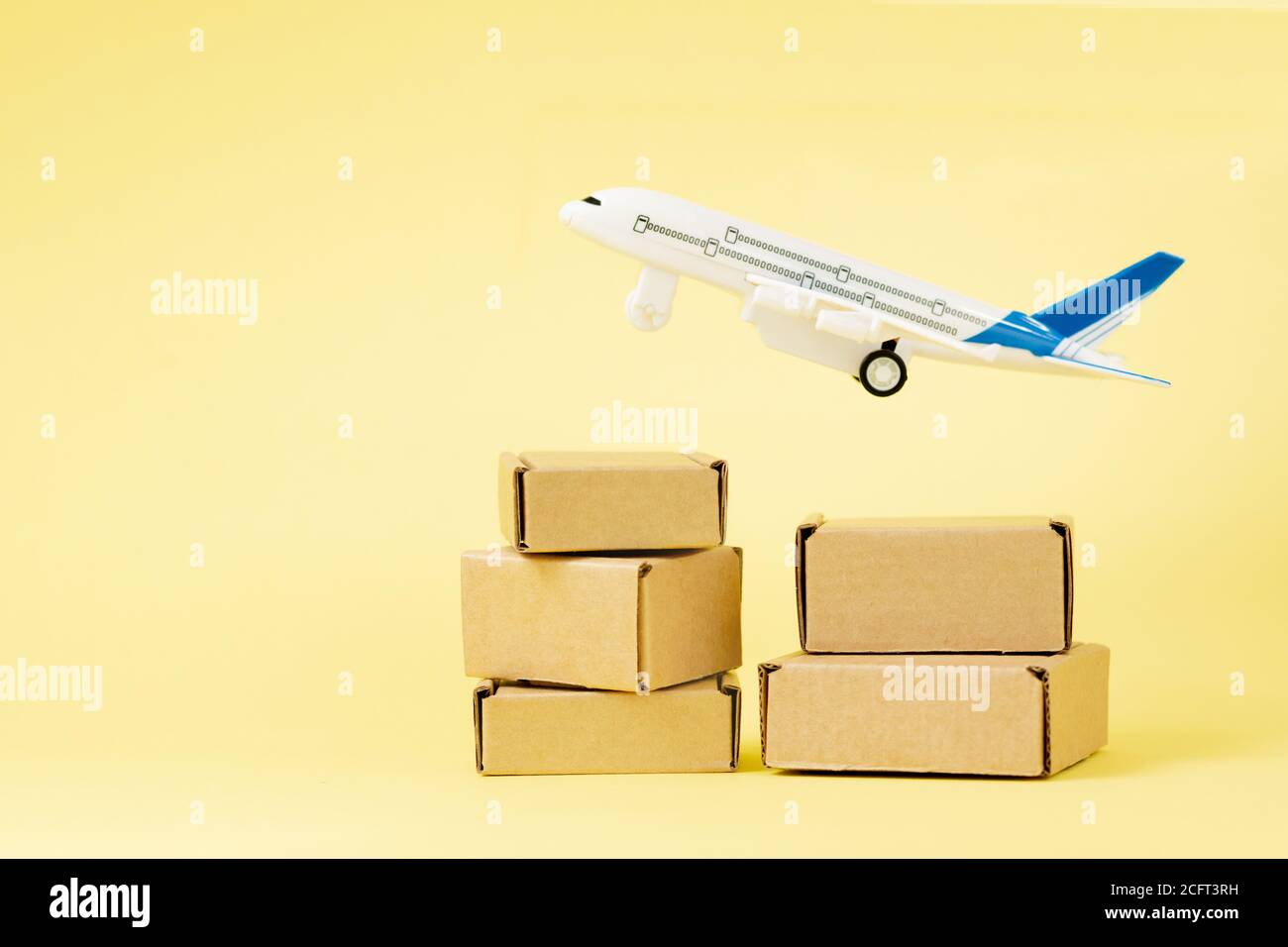 Airplane and stack of cardboard boxes. concept of air cargo and parcels ...
