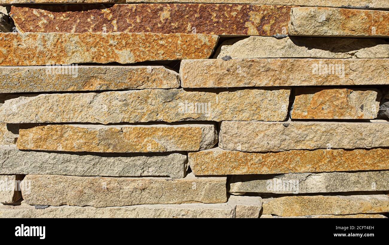 Masonry on the wall and floor. Various stone textures. Multicolored ...