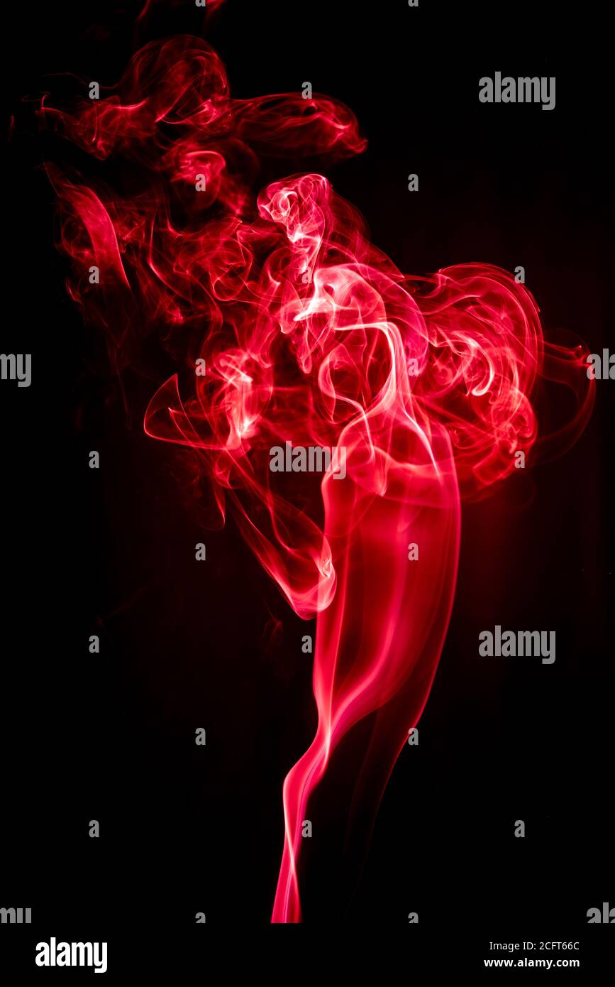 Red abstract shaped smoke against black background. Abstract background ...