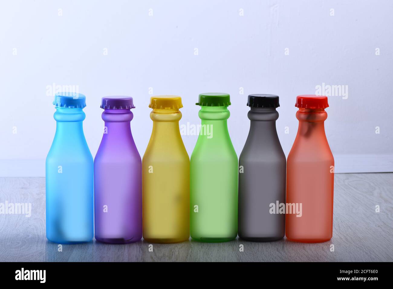 Row of colorful soft drinks on grey background background. Energy ...