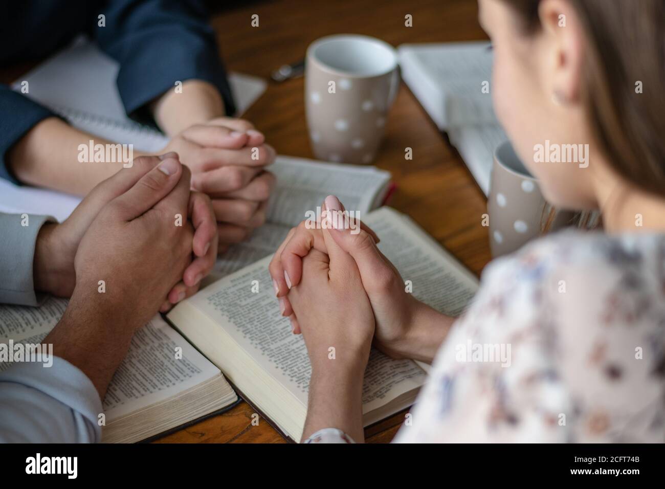 Bible group praying together High Resolution Stock Photography and ...