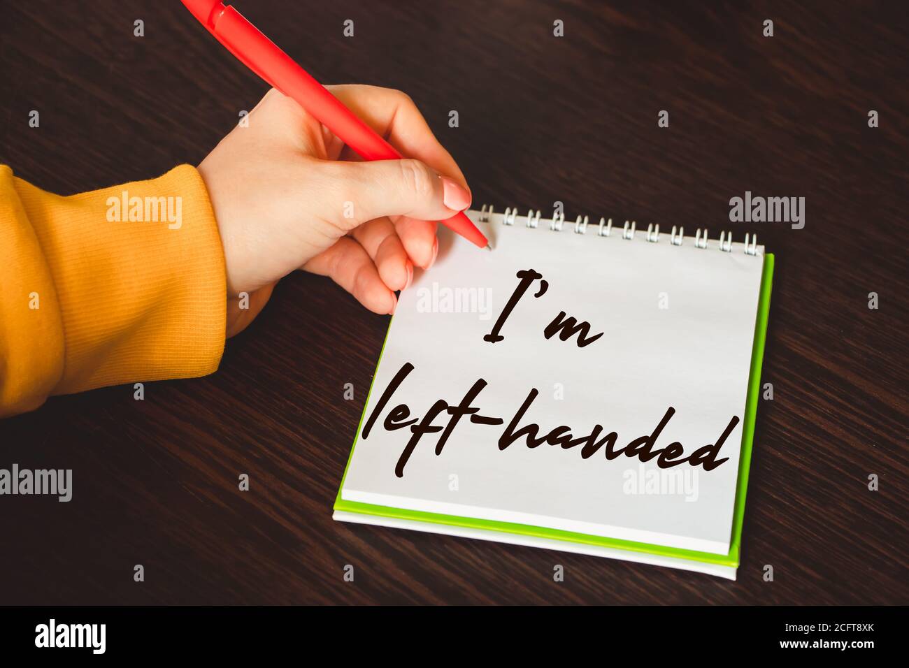 International left-handers day. Holiday August 13th. Woman lefty writes ...