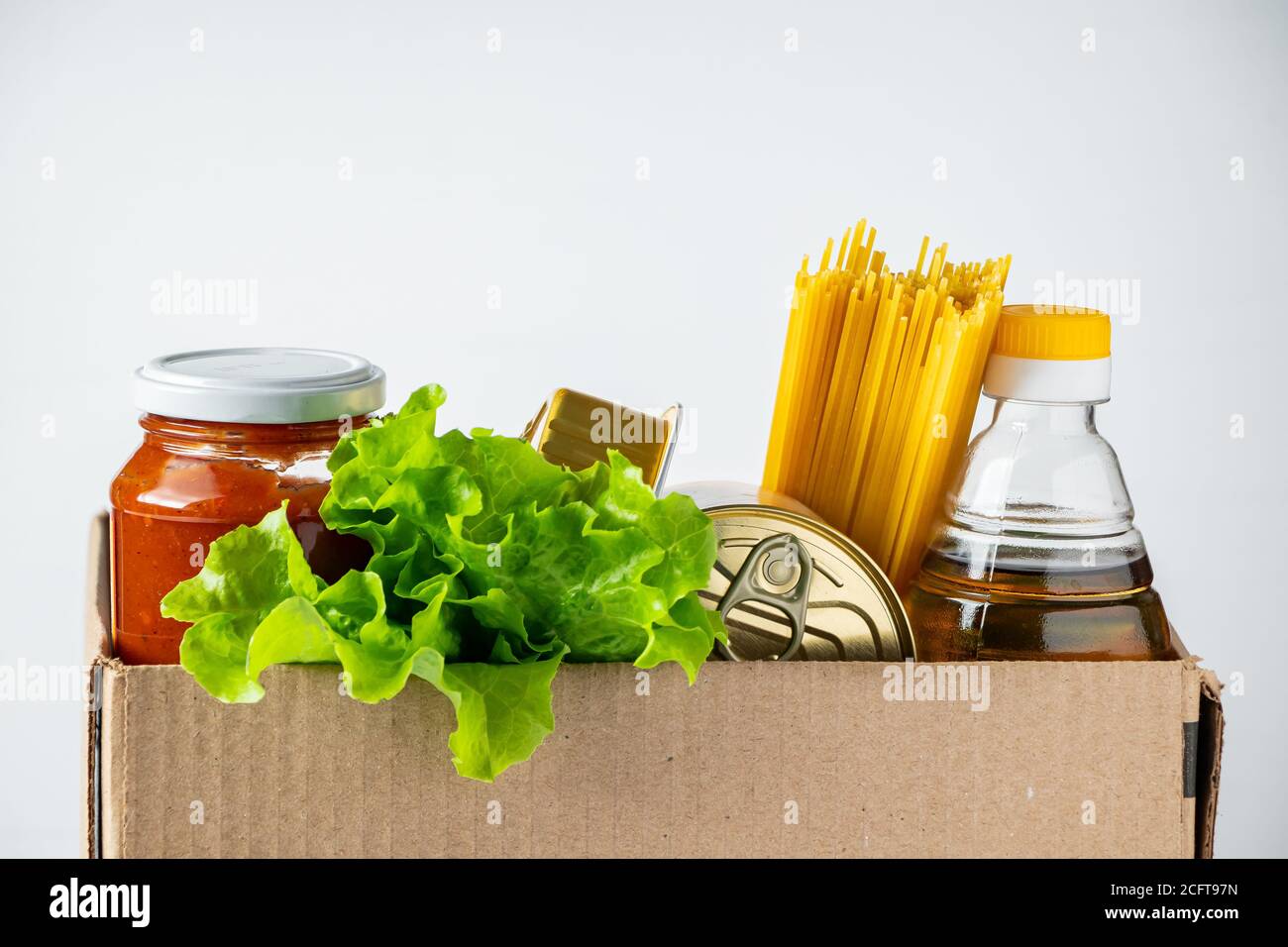 Donation box with food on a white background. Delivery of essential ...
