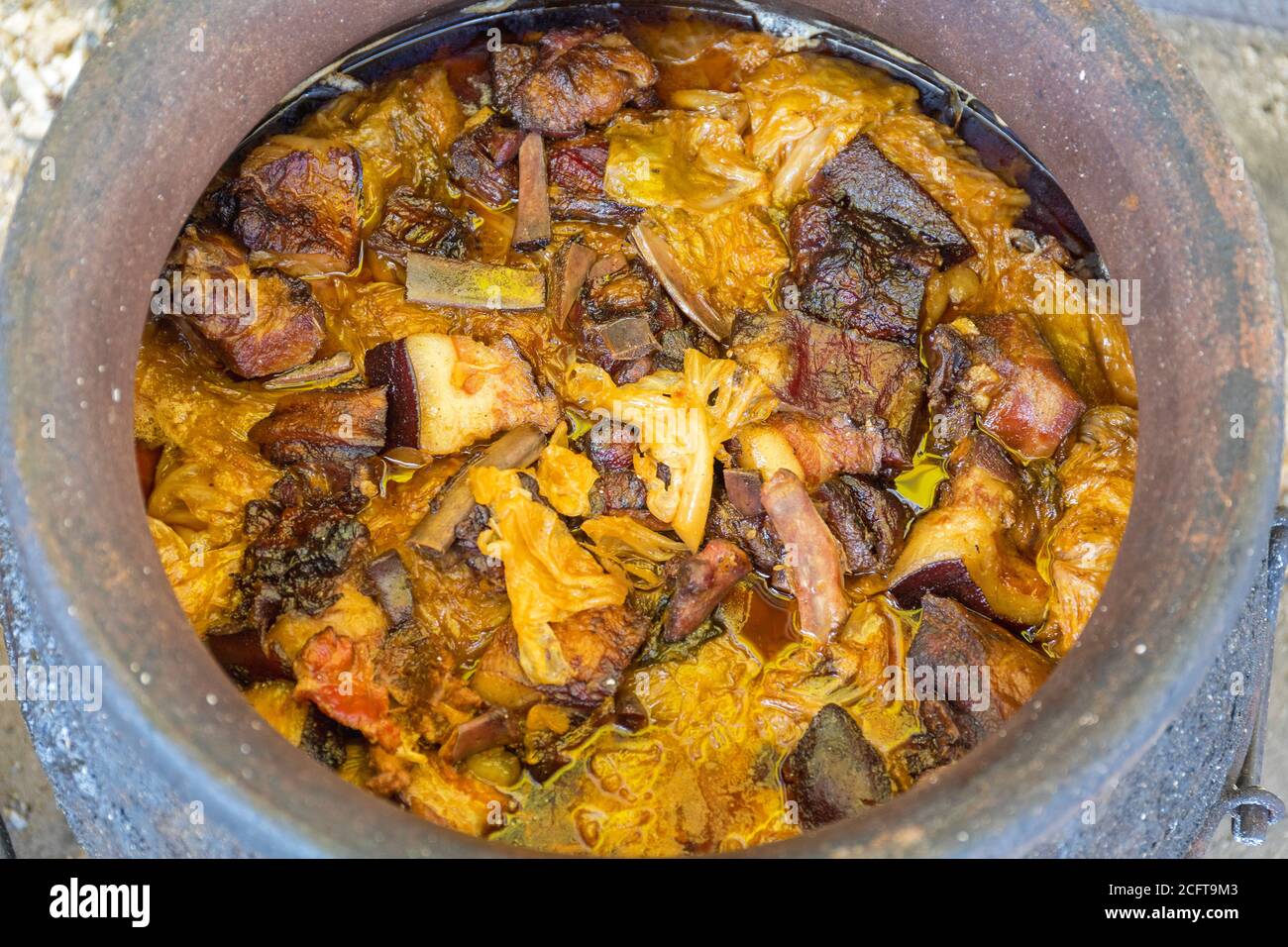 Meat Stew Slow Cooking in Clay Pot Stock Photo - Alamy