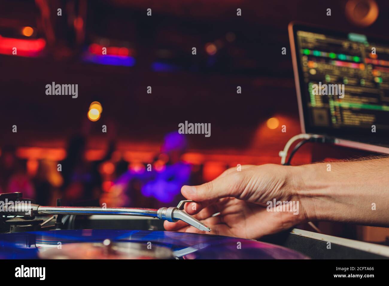 DJ playing vinyl musical record at hip hop party,festival.Concert in ...