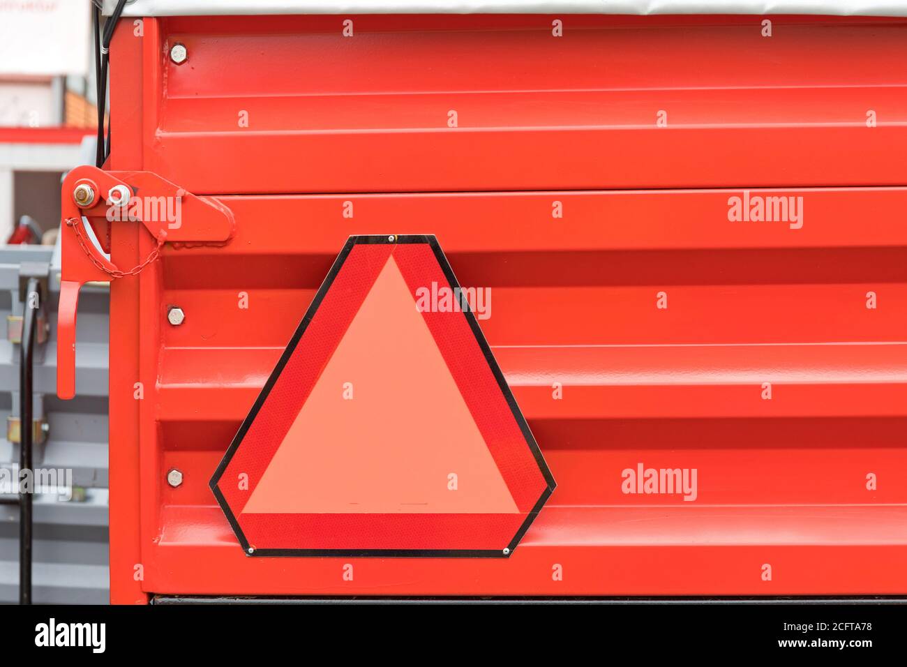 Red Safety Triangle at Agriculture Trailer Stock Photo - Alamy