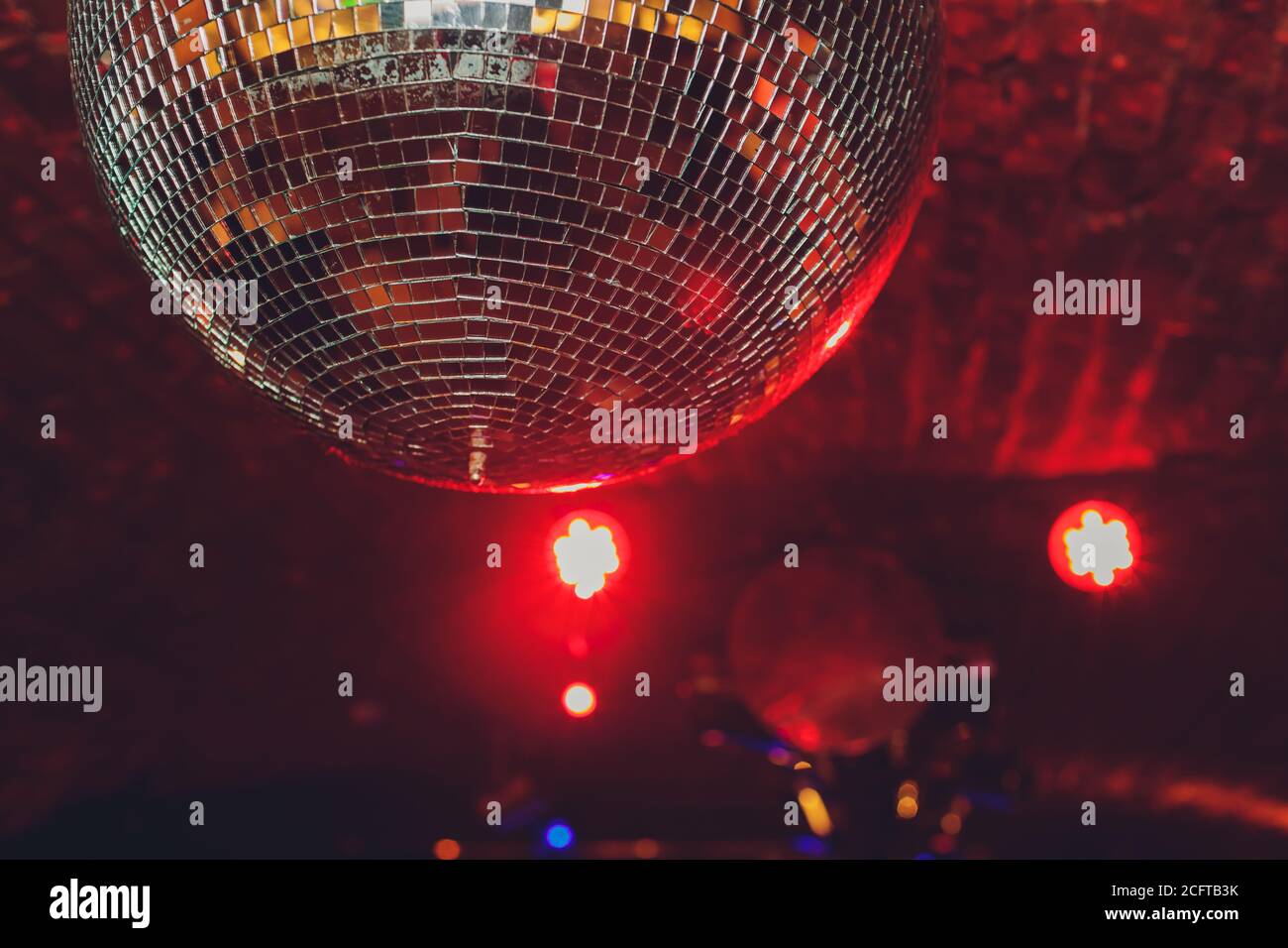 Colorful disco mirror ball lights night club background Stock Photo - Alamy