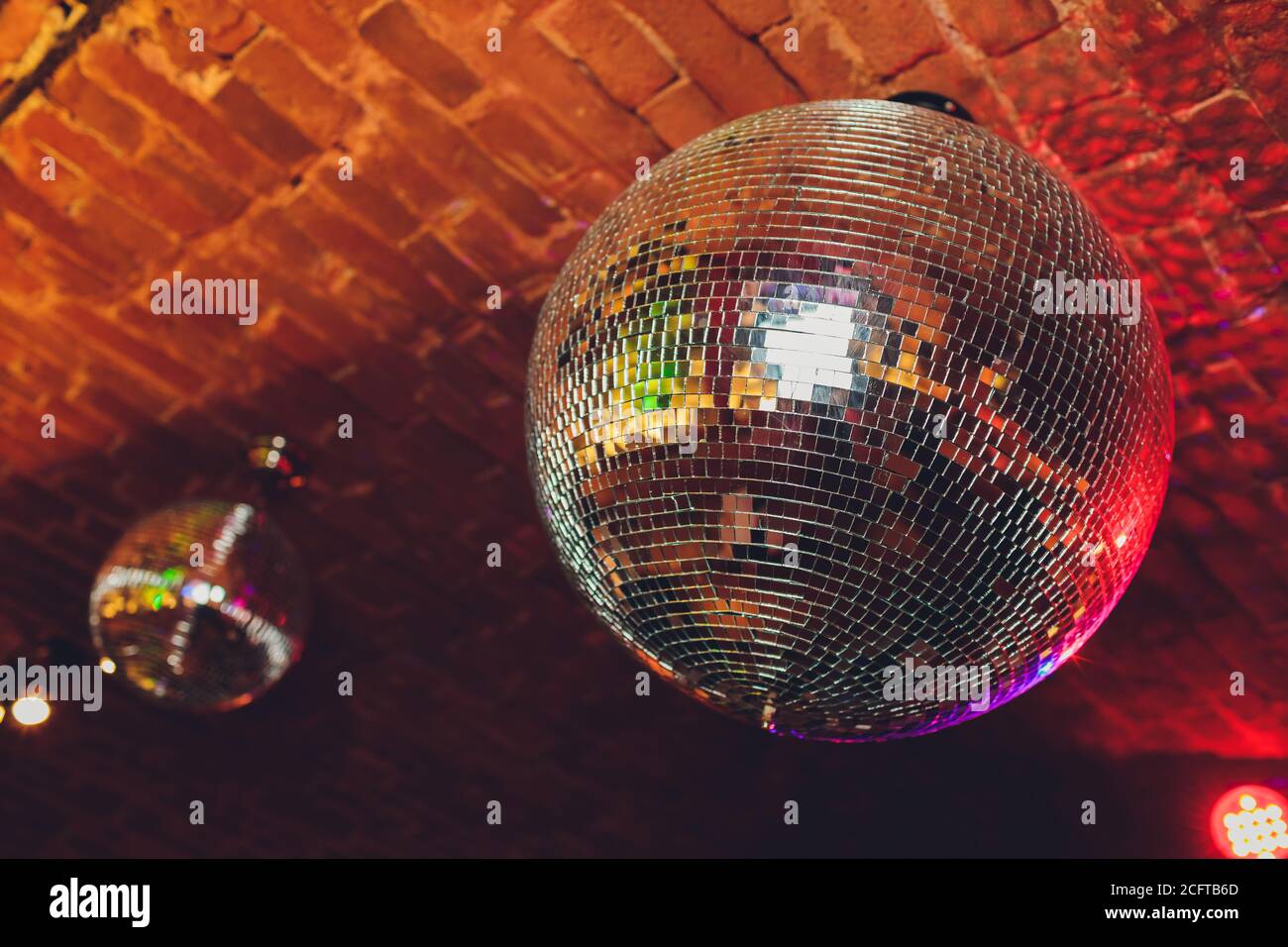 Colorful disco mirror ball lights night club background Stock Photo - Alamy