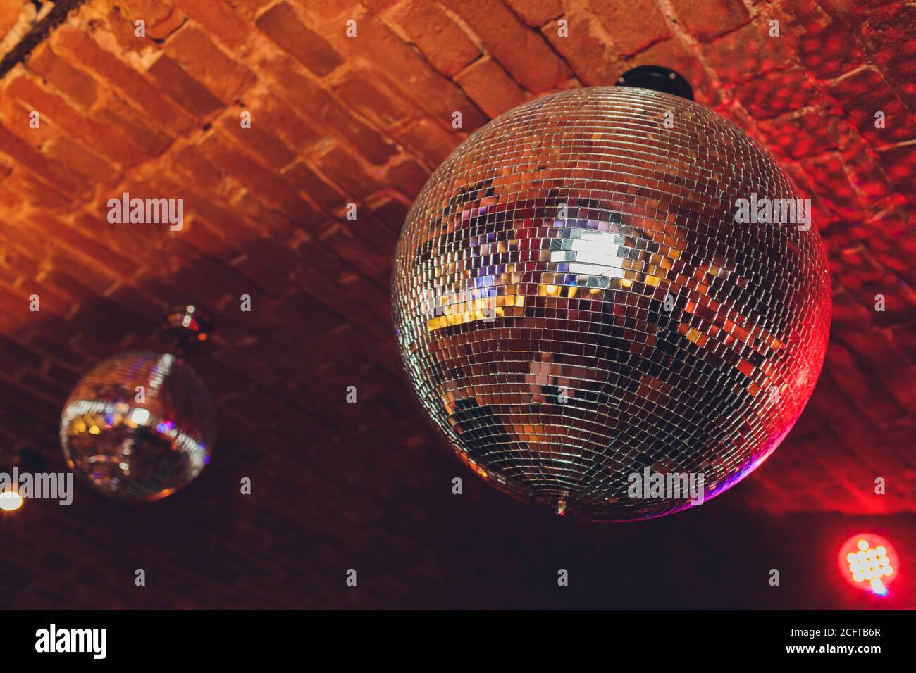 Colorful disco mirror ball lights night club background Stock Photo - Alamy