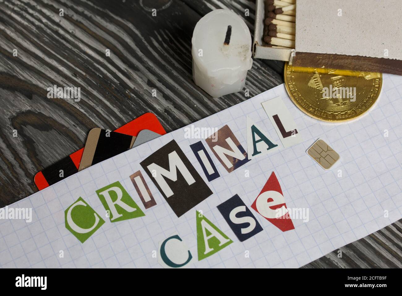 The phrase Criminal case made of letters cut from a magazine and pasted ...