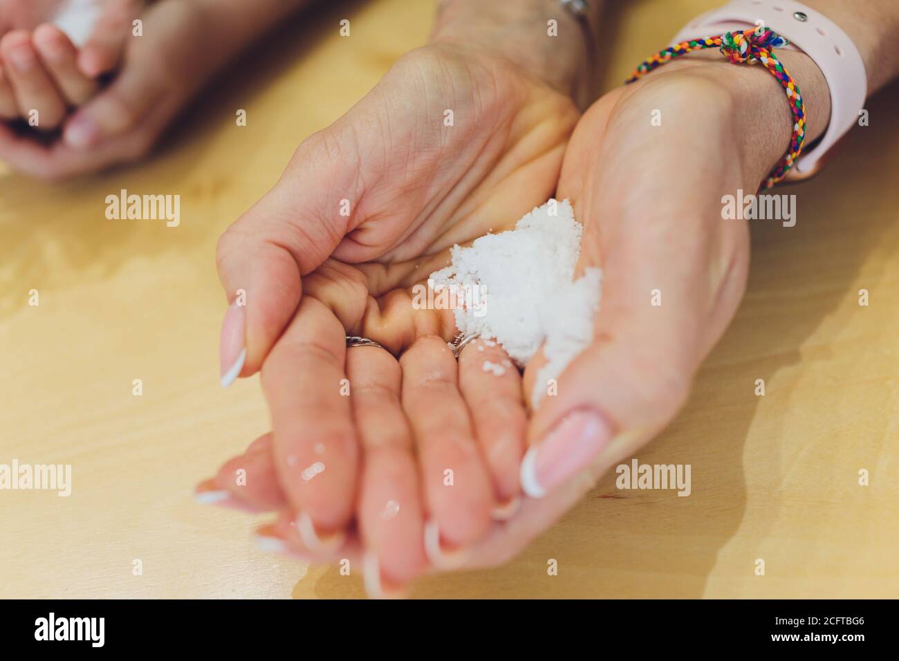 Hand holding white polystyrene foam beads ball drop from Styrofoam ...