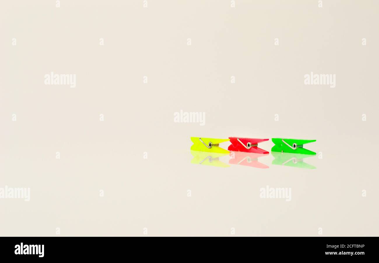 Small tweezers of different colors on plain background Stock Photo - Alamy