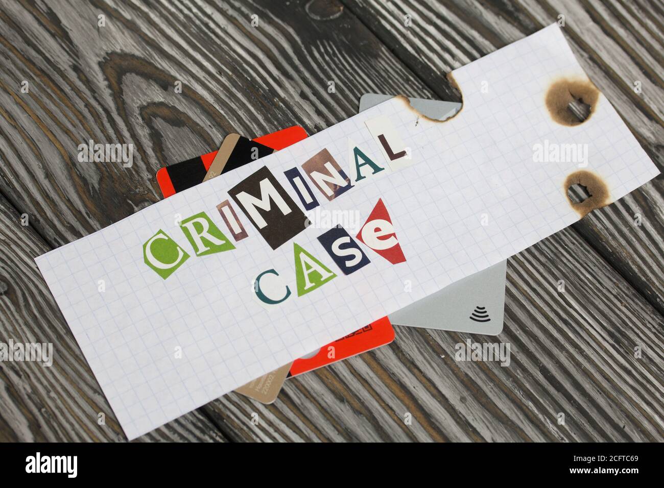 The phrase Criminal case made of letters cut from a magazine and pasted ...