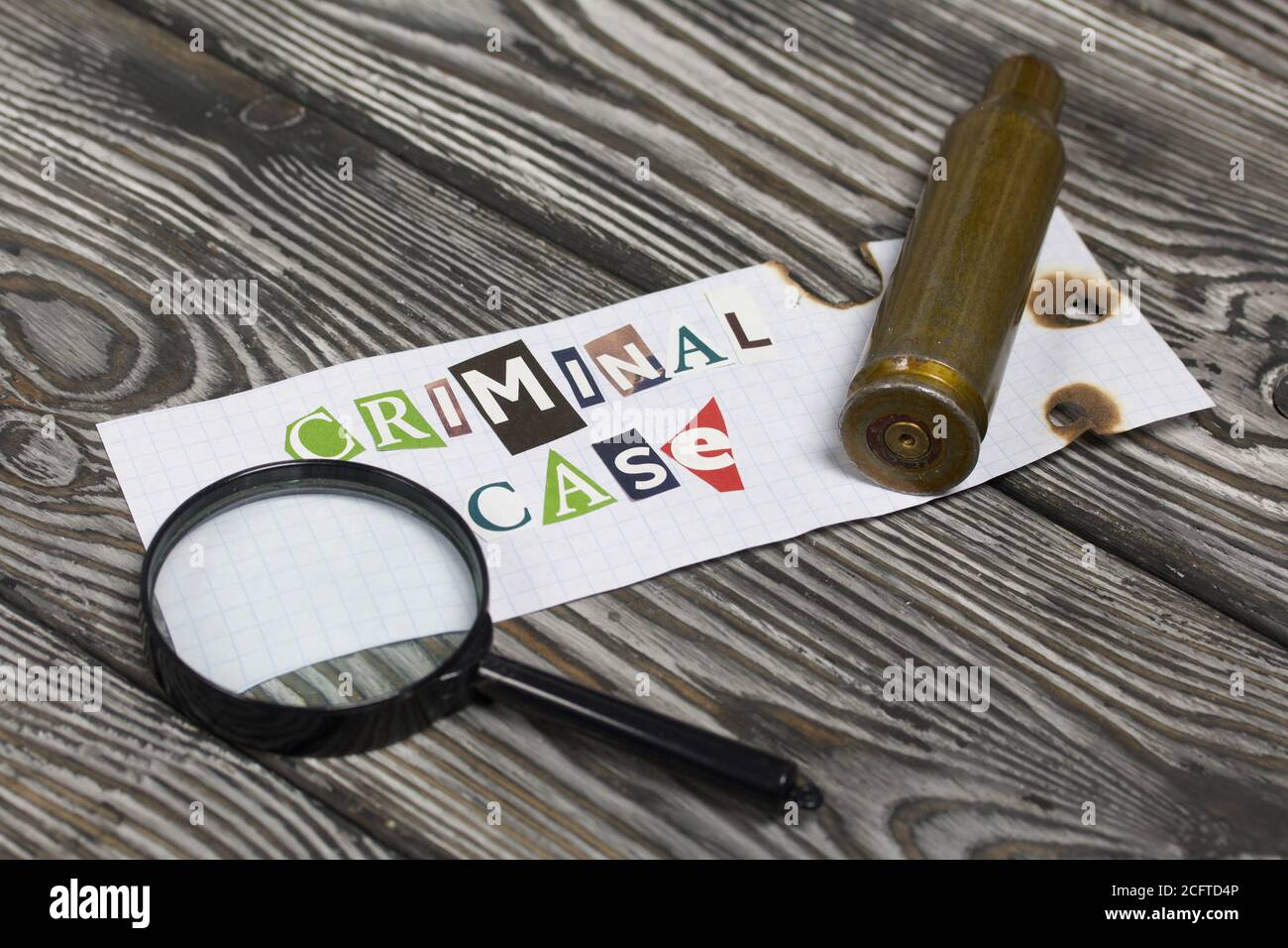 The phrase Criminal case made of letters cut from a magazine and pasted ...