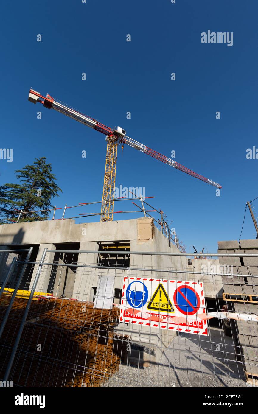 Construction site in France with a crane, clear blue sky, low angle ...