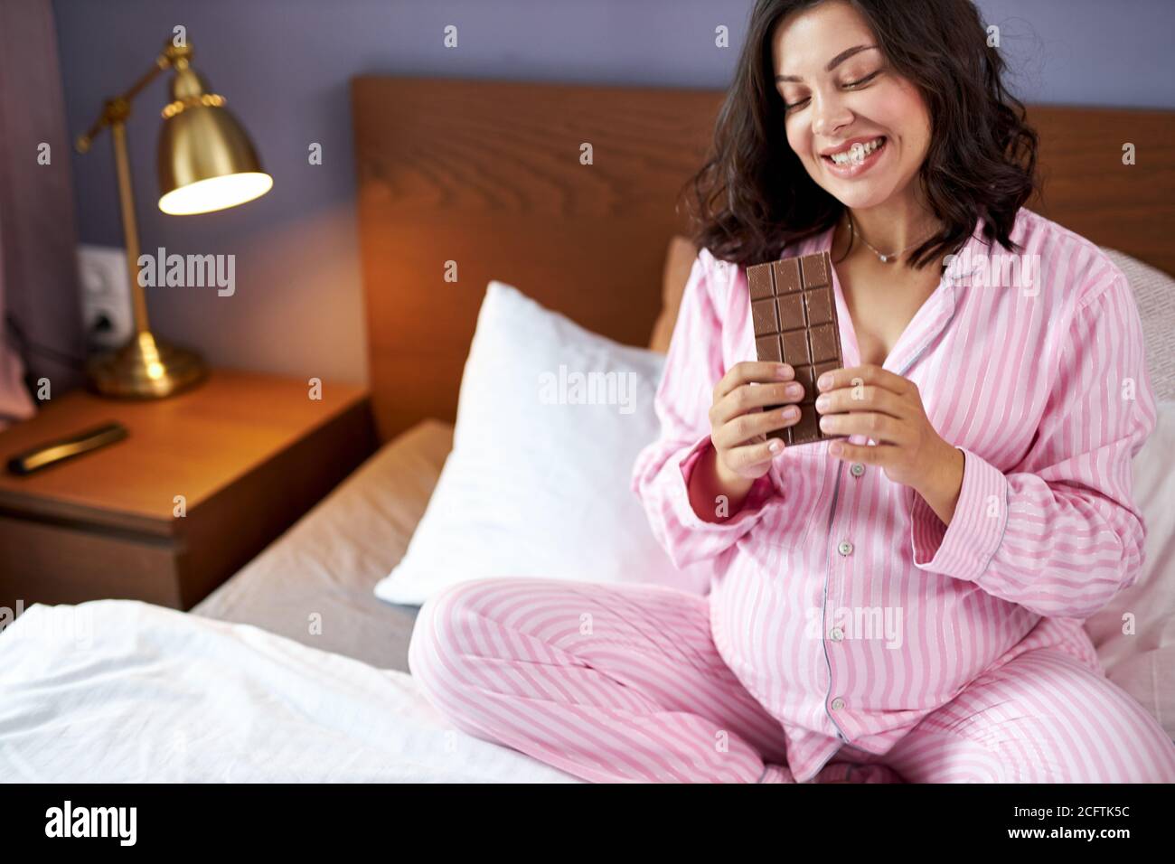 Pregnant Woman Enjoys Eating Chocolate In Bed At Home Unhealthy Sweet