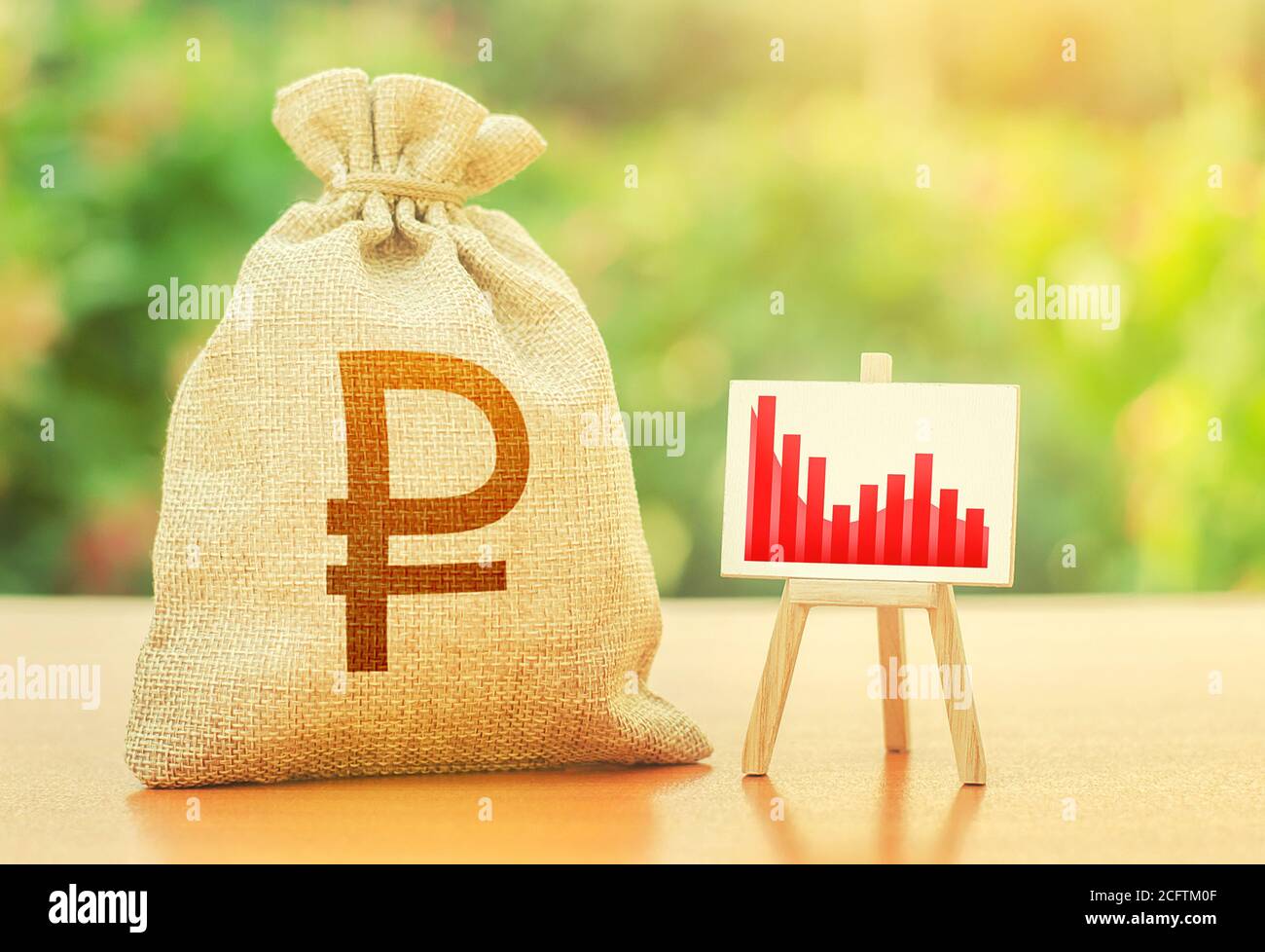 Russian ruble money bag and easel with red negative growth graph chart ...