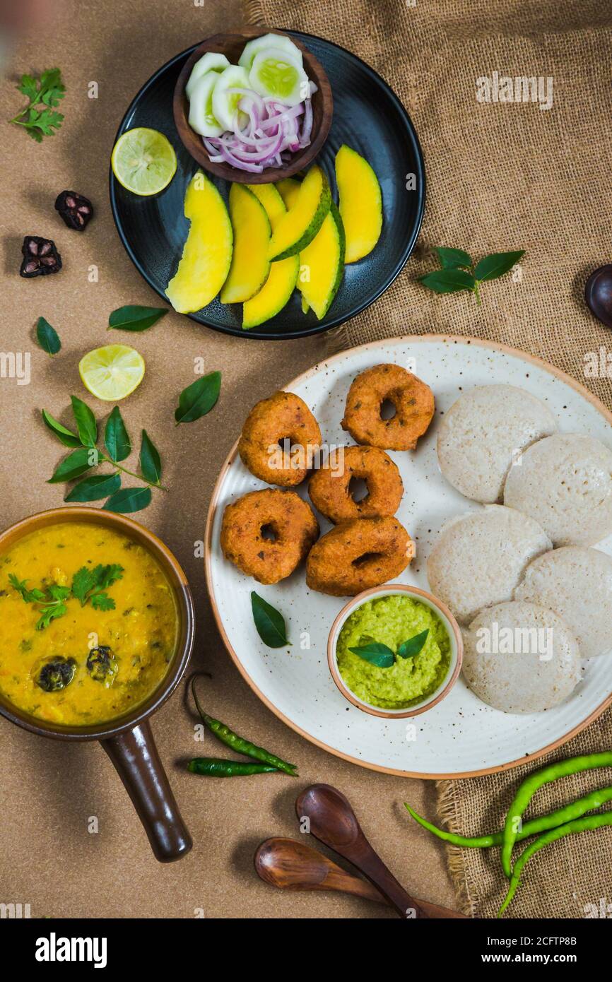 Top view of Idli, Wada, Sambar and Chutney. Traditional South Indian ...