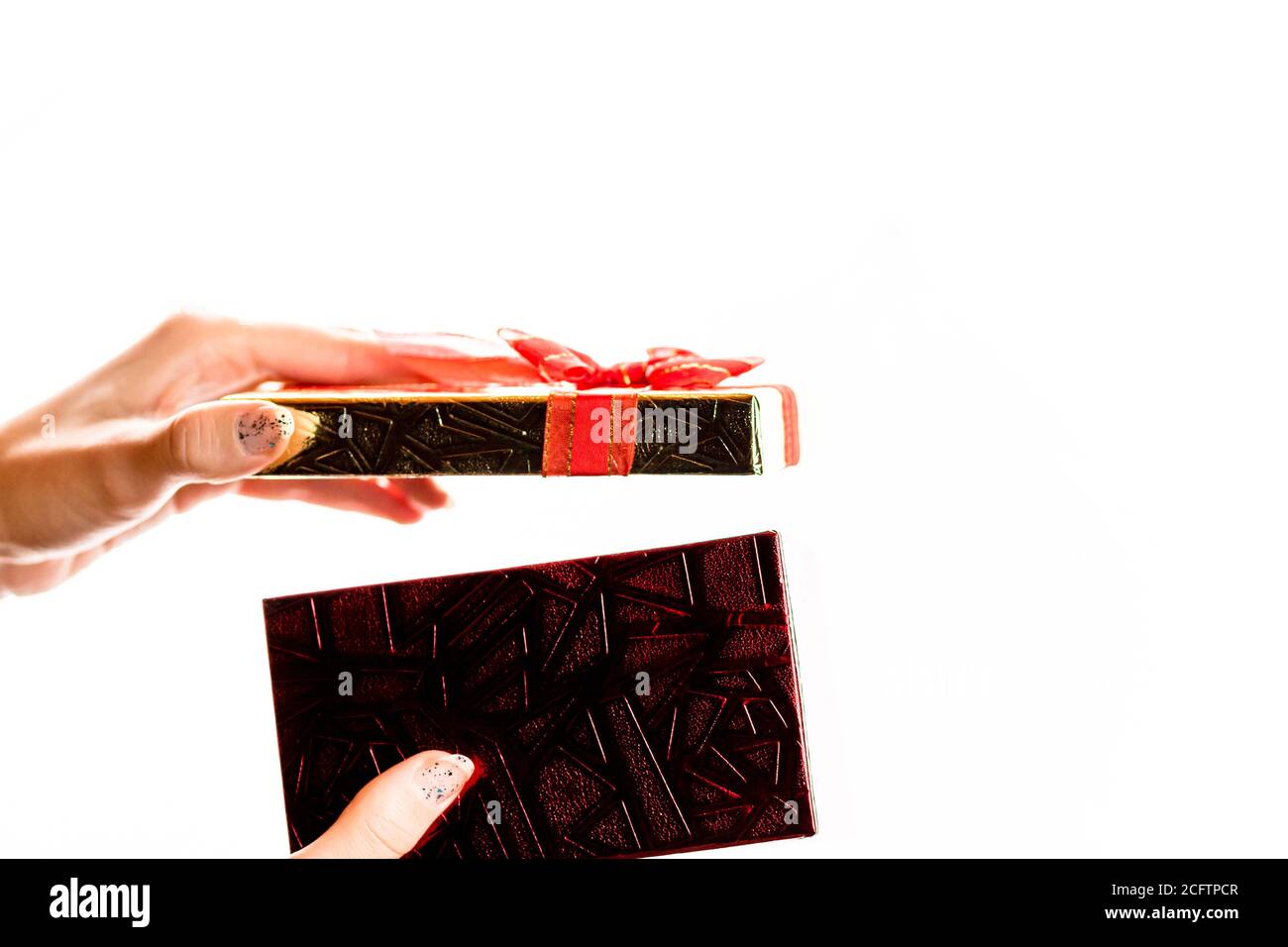 Hand receiving and opening a gift present box isolated on white ...