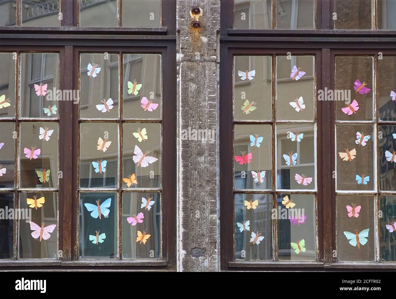 Wooden window frame with colorful butterflies Stock Photo - Alamy