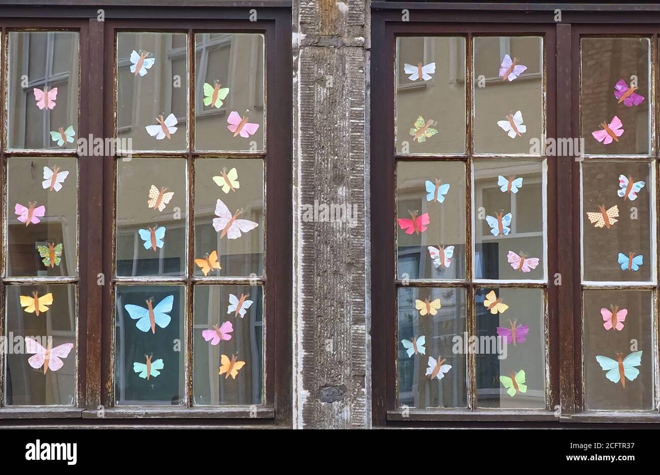 Wooden window frame with colorful butterflies Stock Photo - Alamy