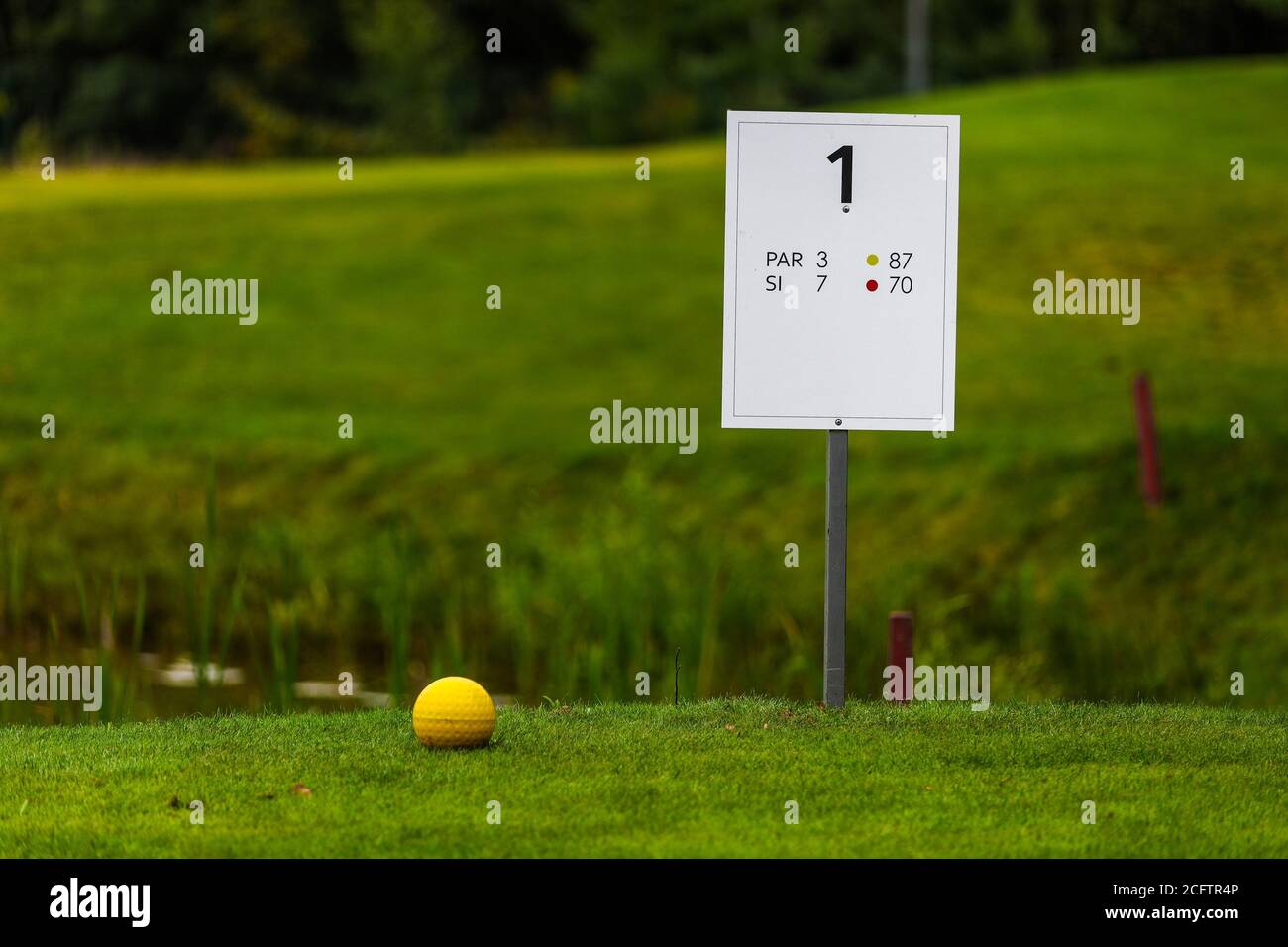 Golf course sign with hole Stock Photo - Alamy
